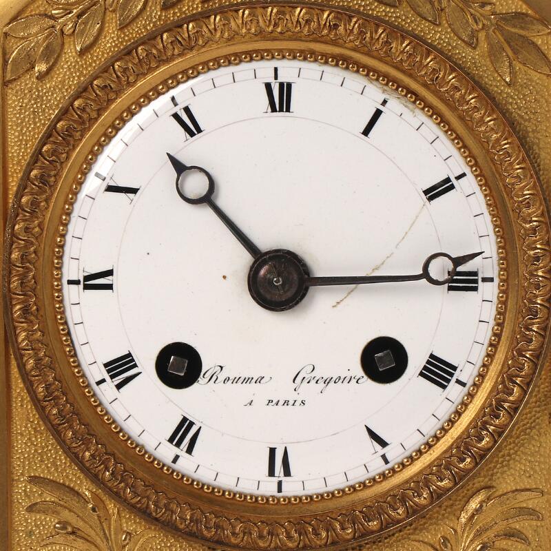 A miniature Empire gilt bronze mantel clock. Signed 'Rouma-Gregoire ...