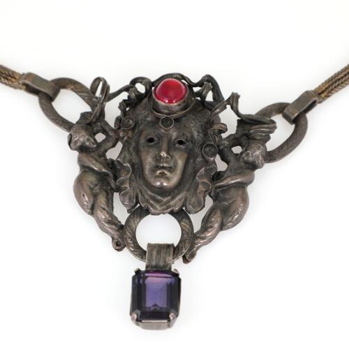 Torben Hardenberg: A necklace of metal with pendant in the shape of a ...