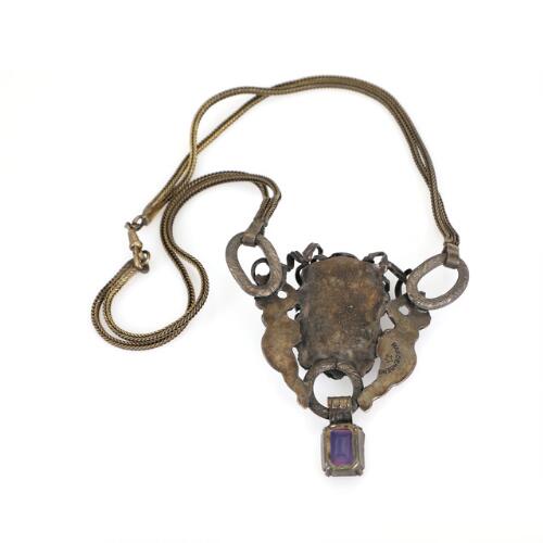 Torben Hardenberg: A necklace of metal with pendant in the shape of a ...