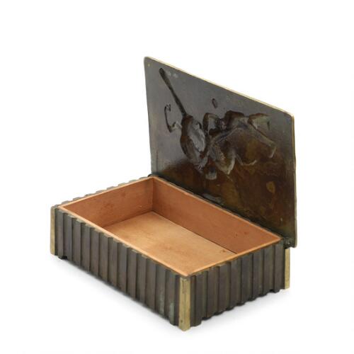 SOLD. An Art Déco patinated bronze cigar box, lid decorated with ...