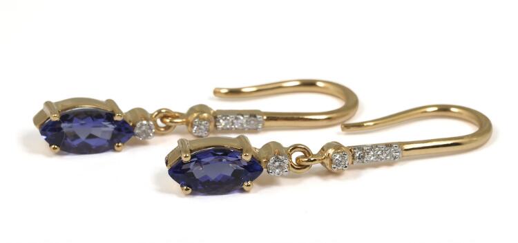 A pair of tanzanite- and diamond ear studs each set with tanzanite and ...