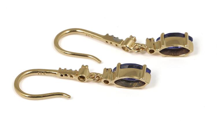 A pair of tanzanite- and diamond ear studs each set with tanzanite and ...