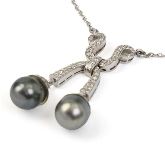A pearl- and diamond necklace set with Tahiti cultured pearls and ...