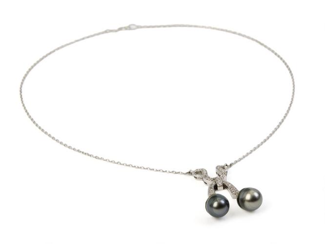 A pearl- and diamond necklace set with Tahiti cultured pearls and ...