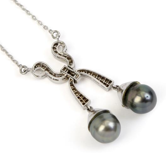 A pearl- and diamond necklace set with Tahiti cultured pearls and ...