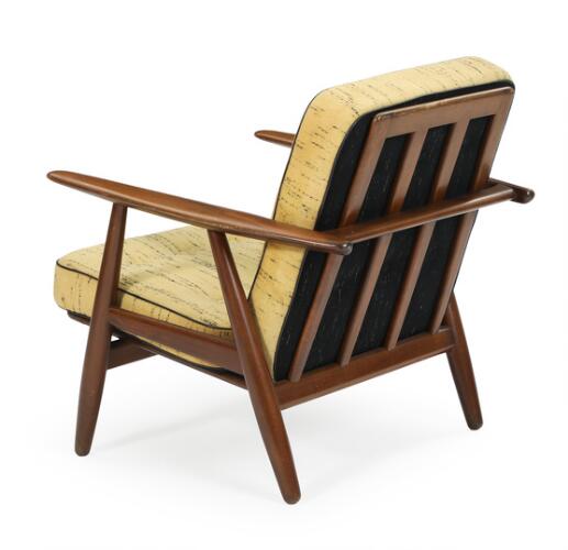 Hans J. Wegner: "The Cigar". Easy chair with stained beech frame ...